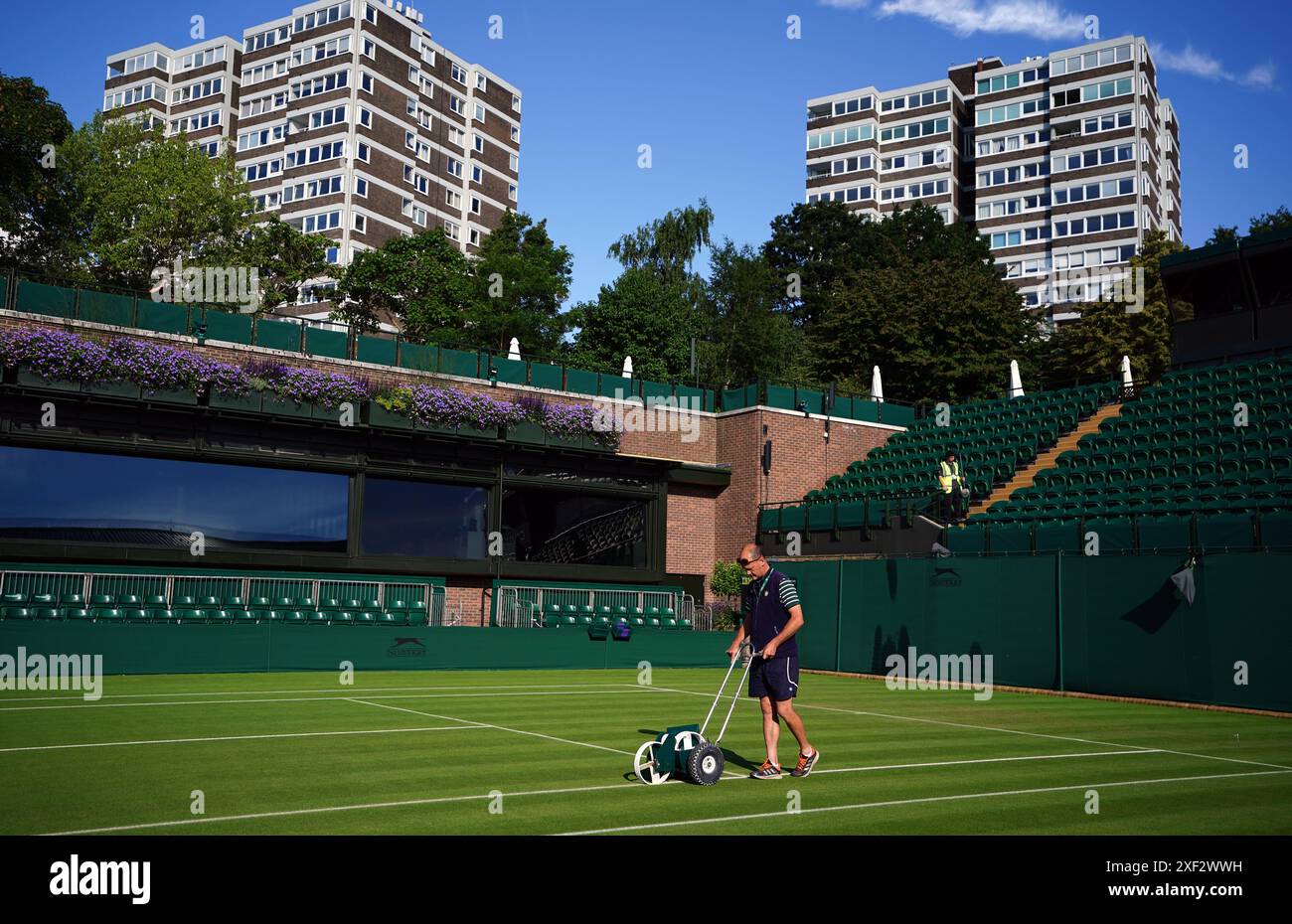 Ground staff prepare the outside courts on day one of the 2024 ...