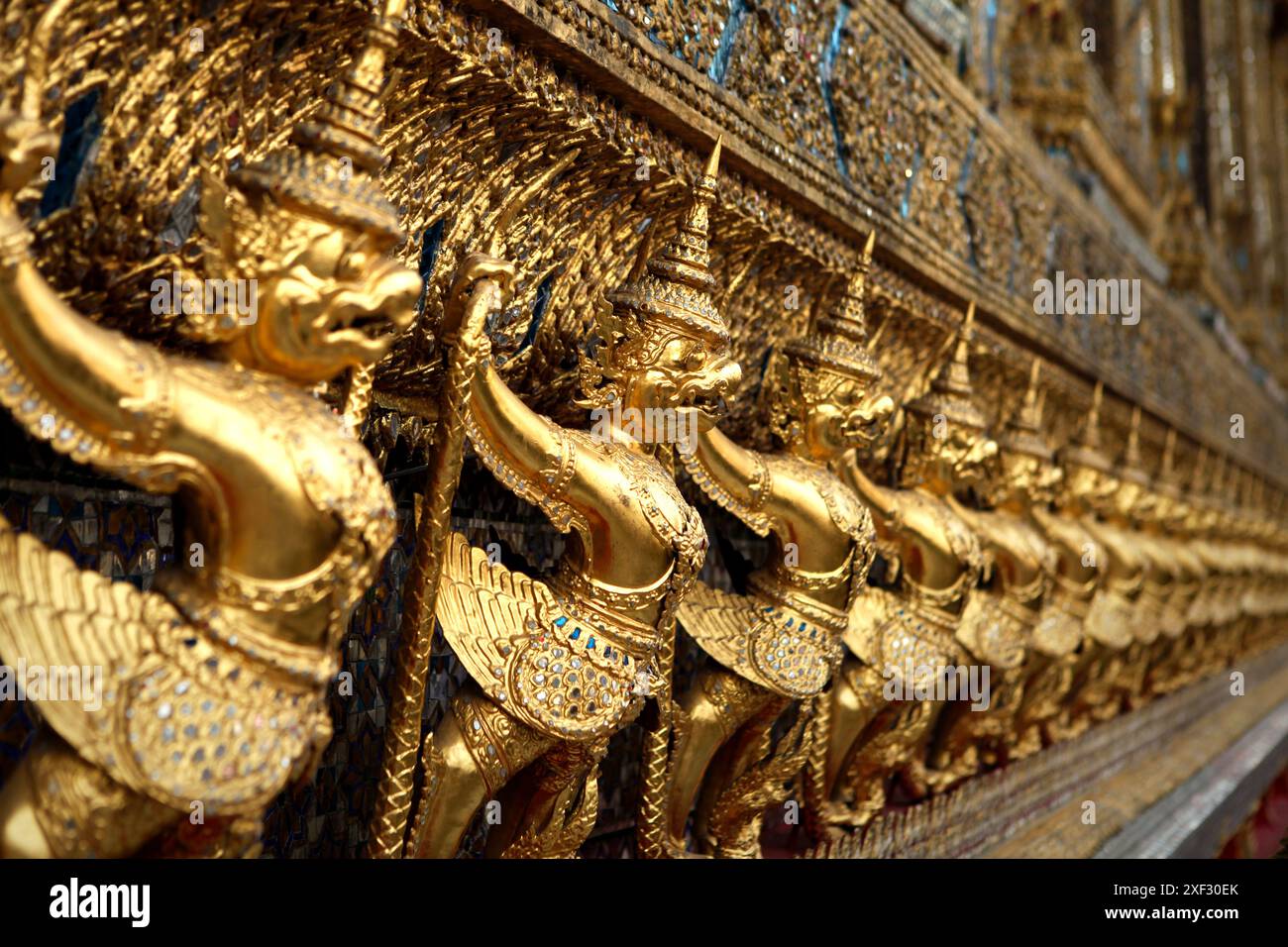 Mythological garuda and naga sculptures at Wat Phra Kaew temple inside ...