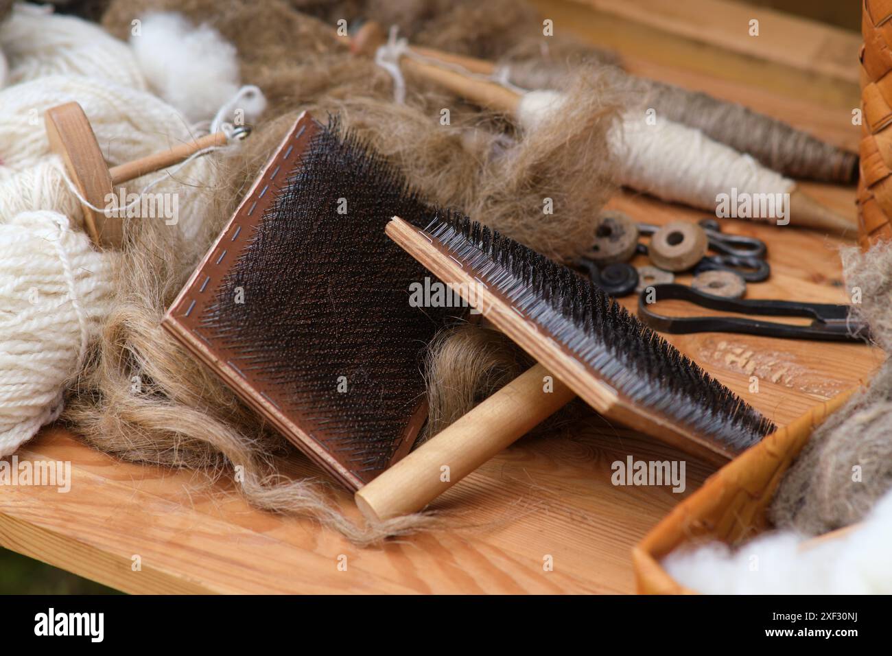 The skill of carding wool by hand, is crucial for producing quality ...