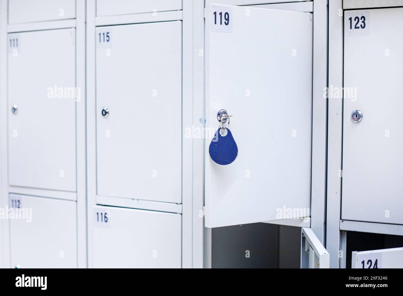 close-up of open and closed cabinets with a lock for storing things in ...