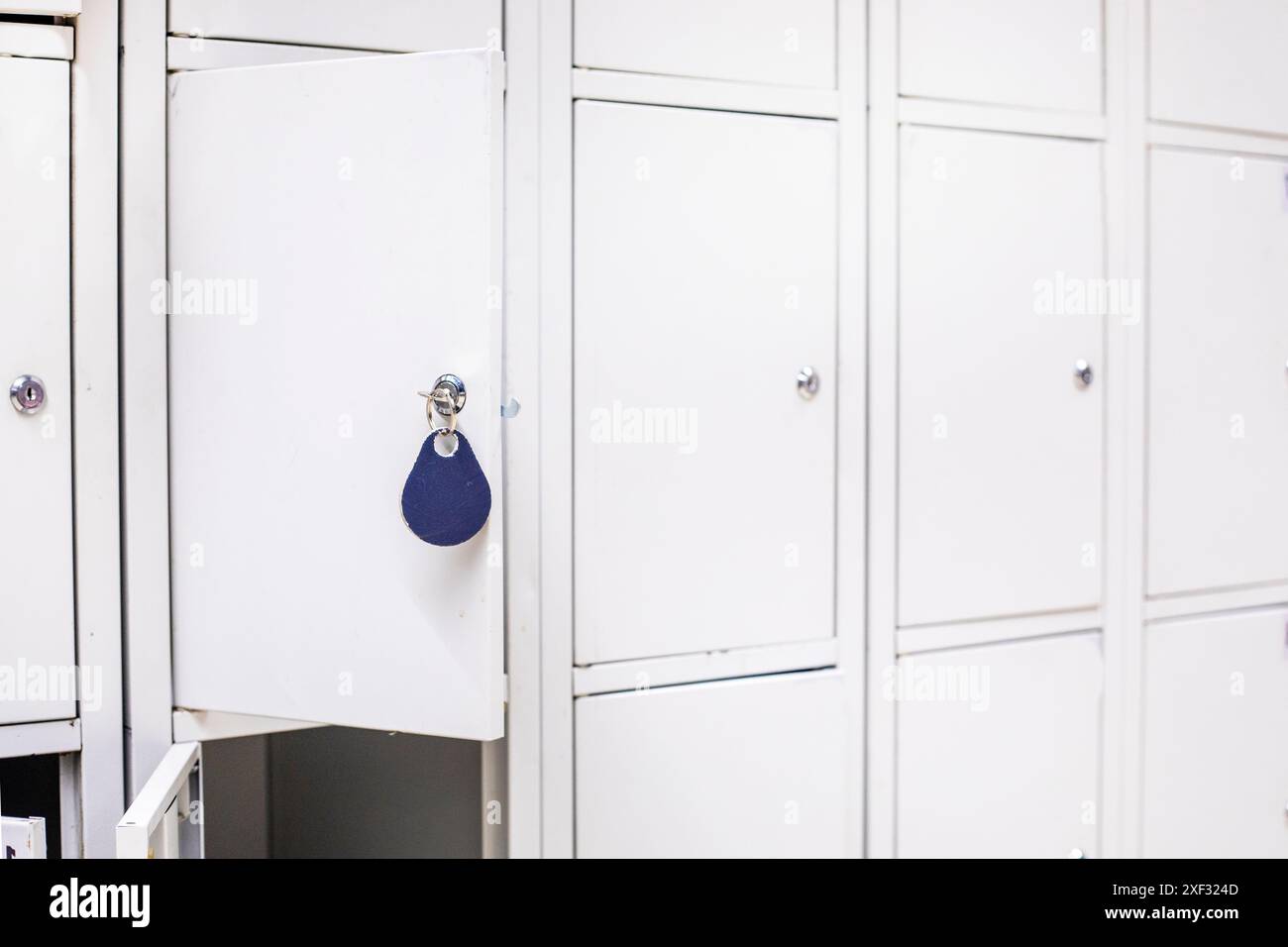 close-up of open and closed cabinets with a lock for storing things in ...