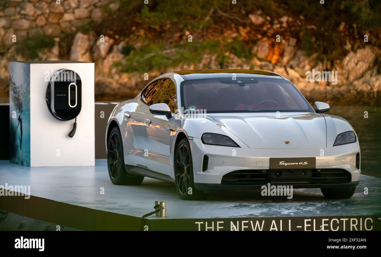 Porsche Taycan 4S with supercharger on floating display platform Stock ...