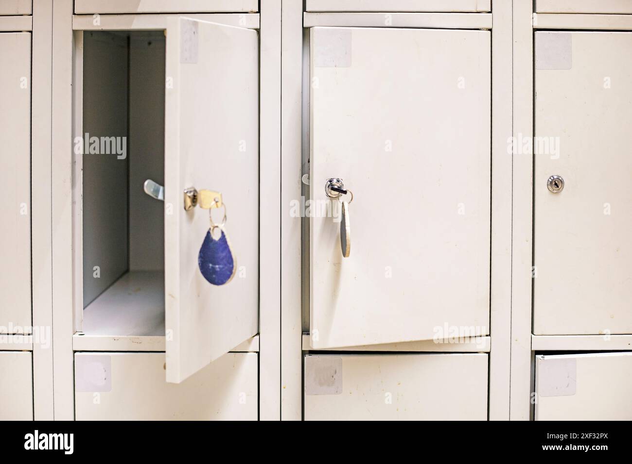 open and closed cabinets with a lock for storing things in front of the ...