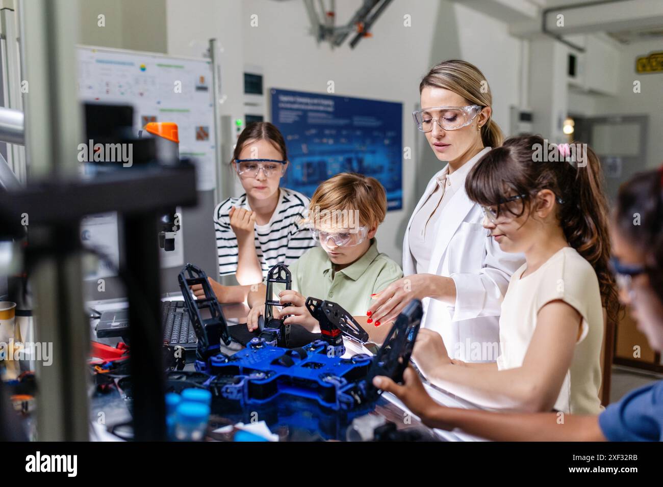 Children learning robotics in Elementary school. Young students ...