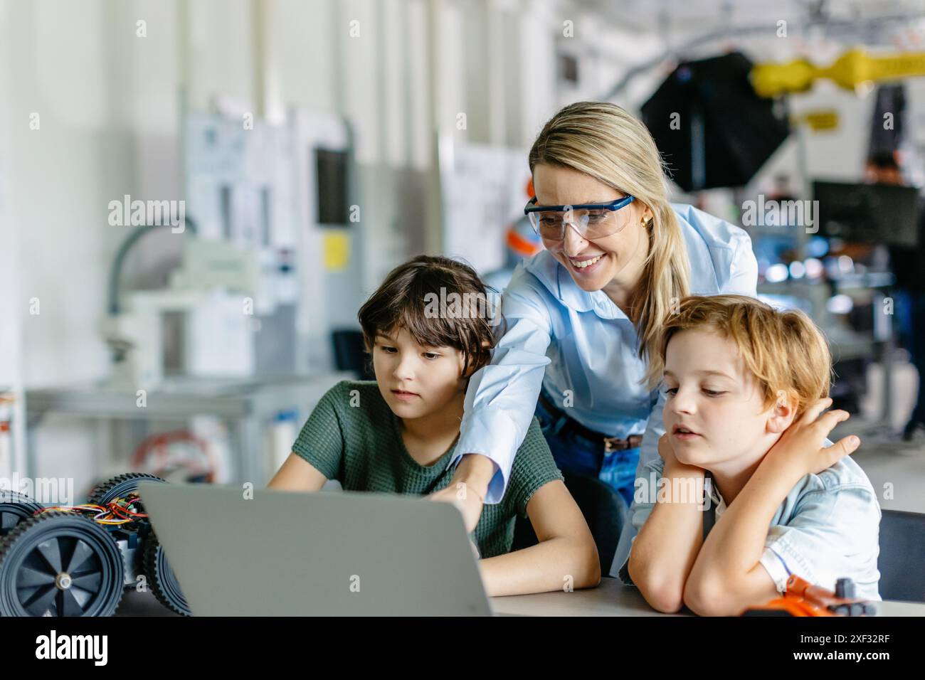 Children learning robotics in Elementary school. Young students ...