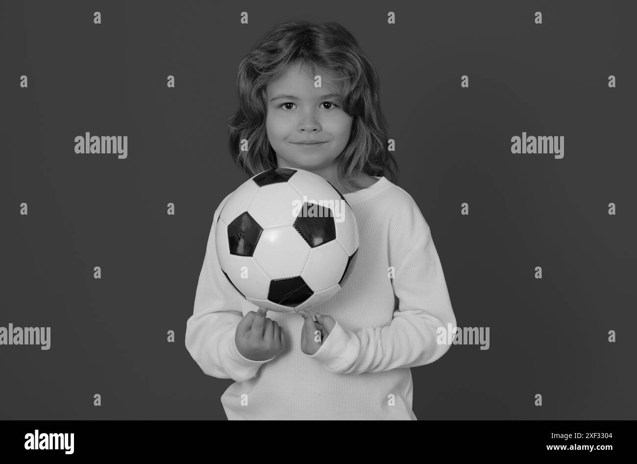 Little boy playing soccer Black and White Stock Photos & Images - Alamy