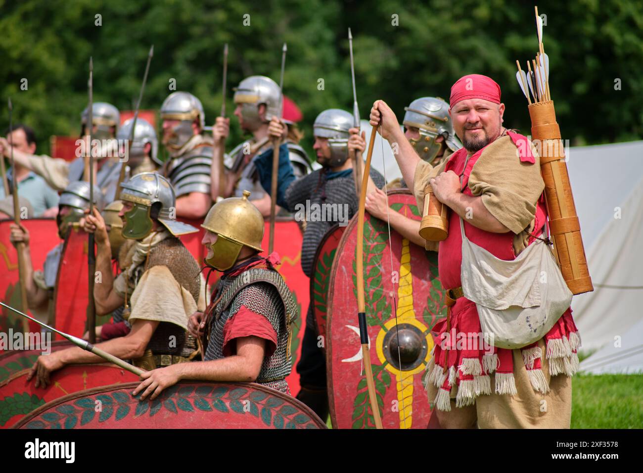 Soldiers of the first Roman Legion stand in a row in ammunition and ...