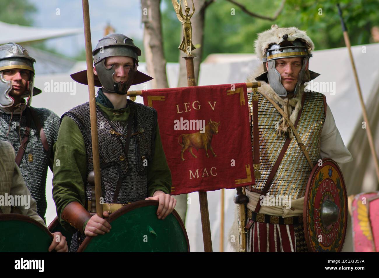 Soldiers of the V Roman Legion stand in a row in ammunition and with ...