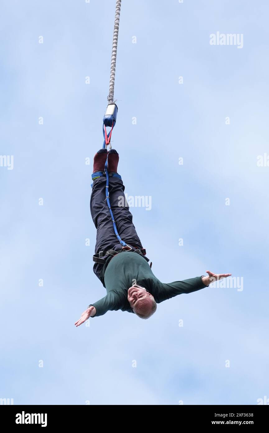 Liberal Democrat leader Sir Ed Davey bungee jumping during a visit to ...