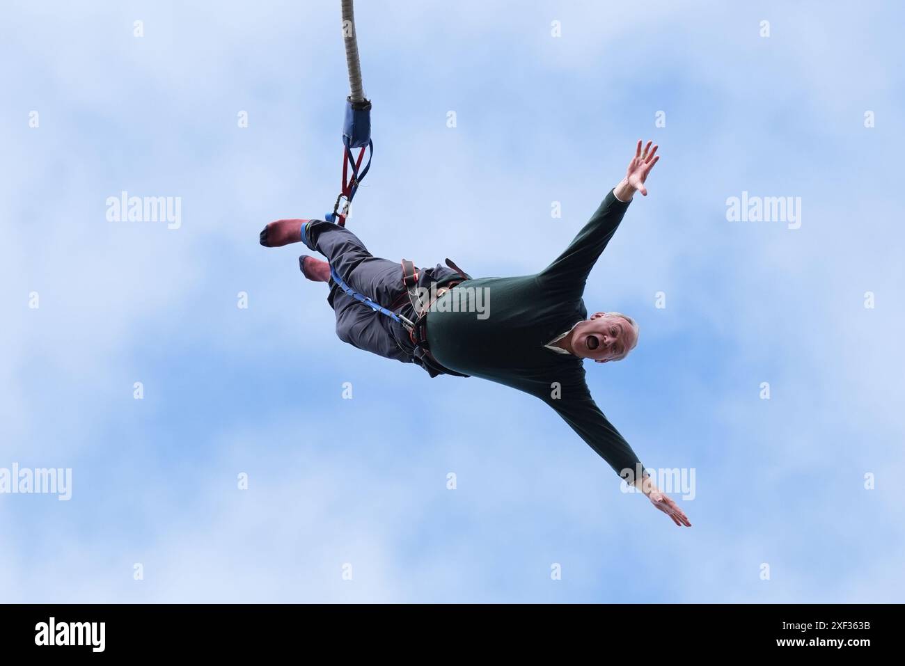 Liberal Democrat leader Sir Ed Davey bungee jumping during a visit to ...