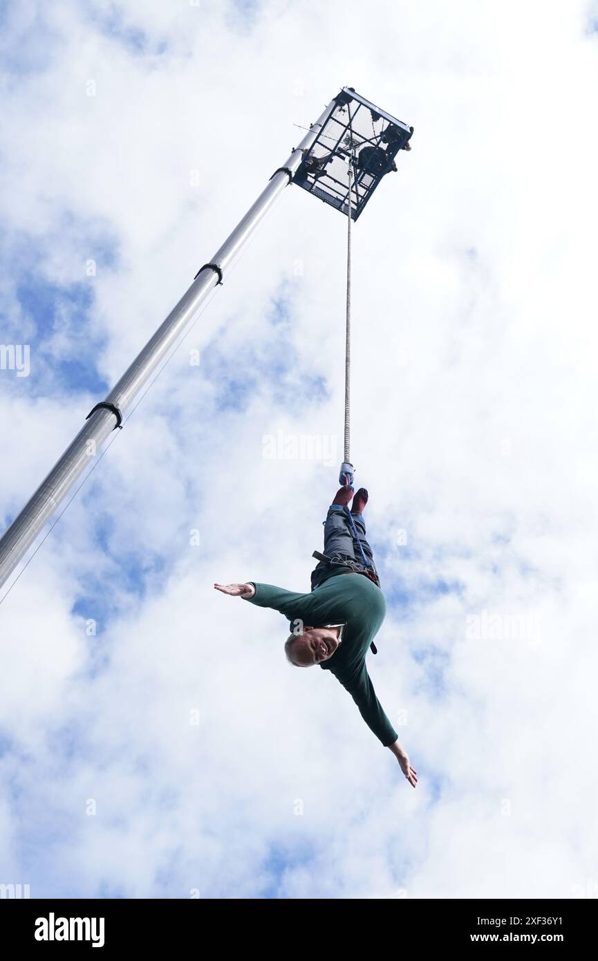 Liberal Democrat leader Sir Ed Davey bungee jumping during a visit to ...
