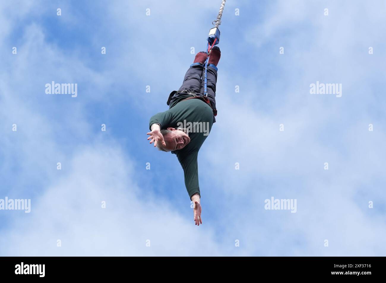 Liberal Democrat leader Sir Ed Davey bungee jumping during a visit to ...