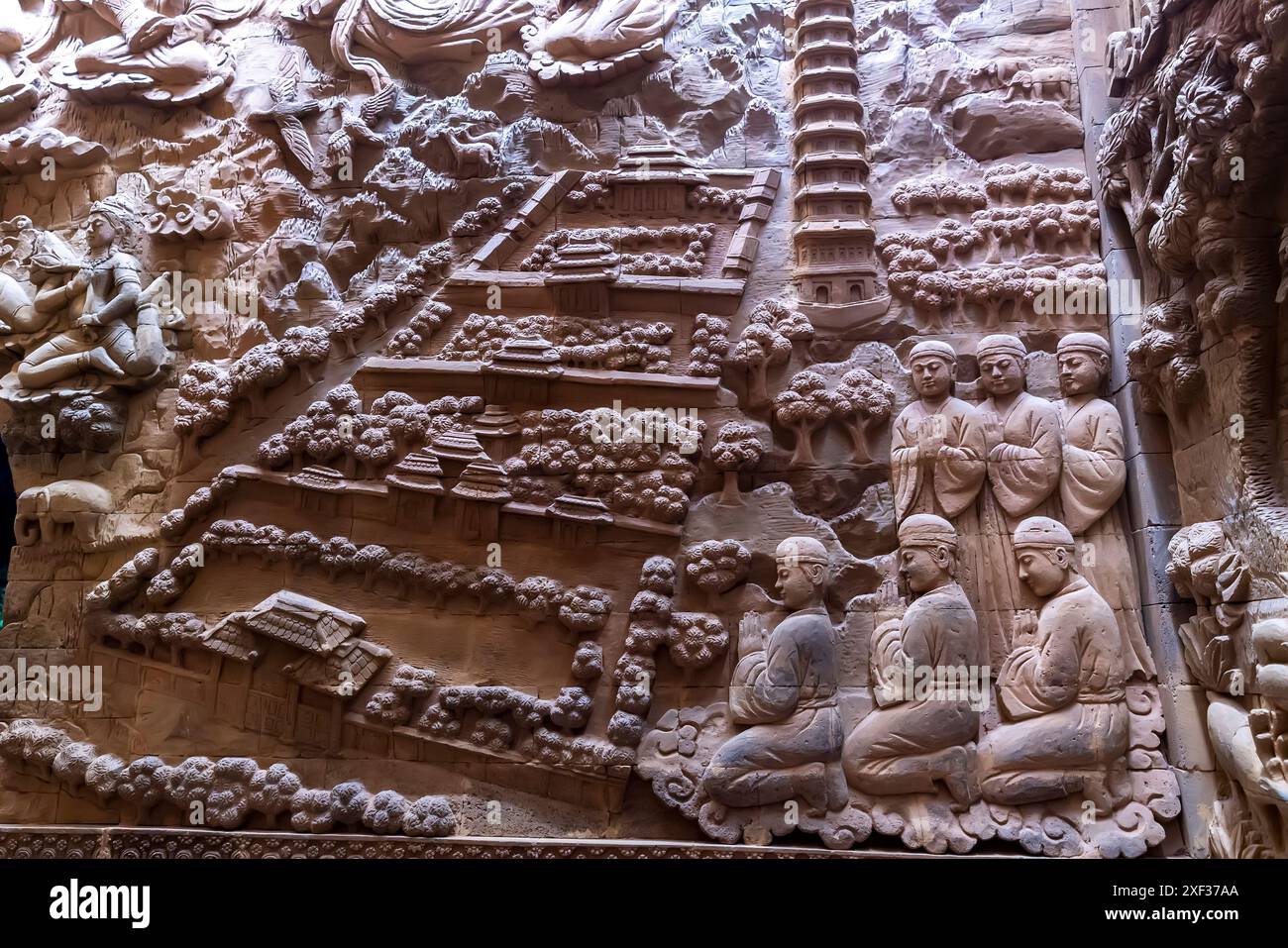 Stone carved base-relief of Ky Lan temple. Human figures and floral ...