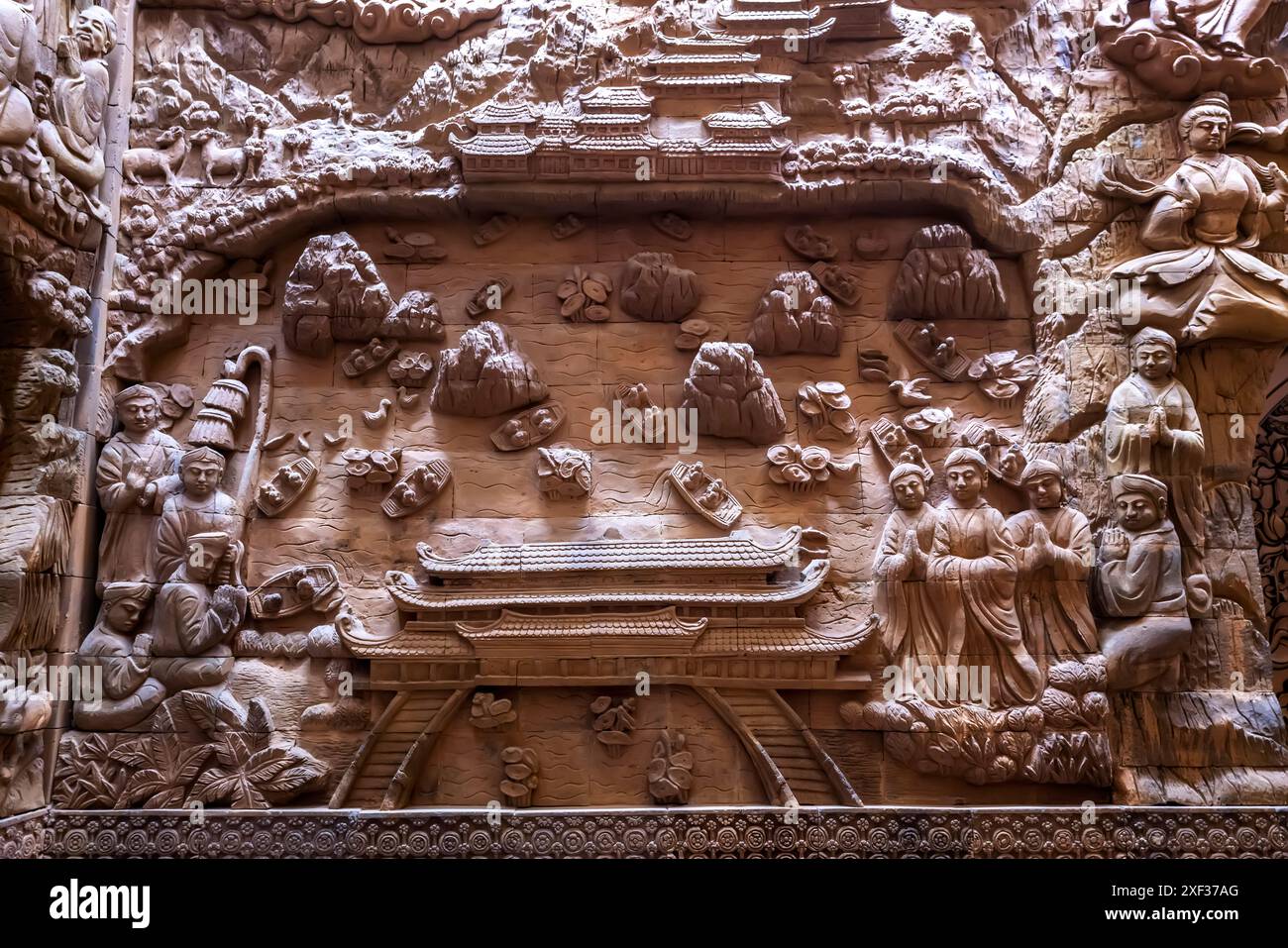 Stone carved base-relief of Ky Lan temple. Human figures and floral ...