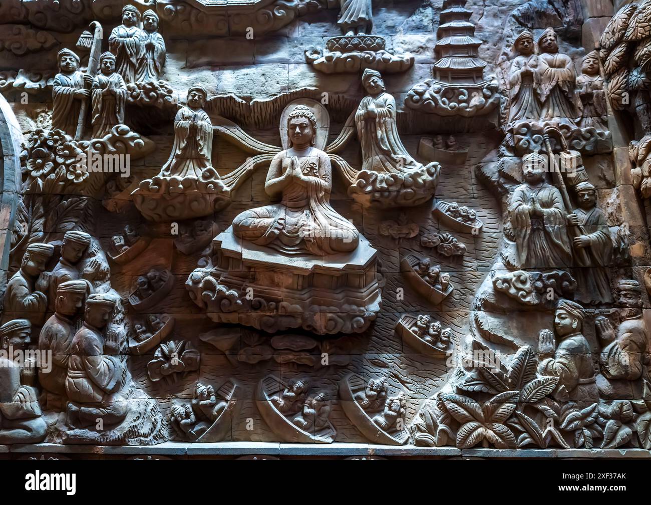 Stone carved base-relief of Ky Lan temple. Human figures and floral ...