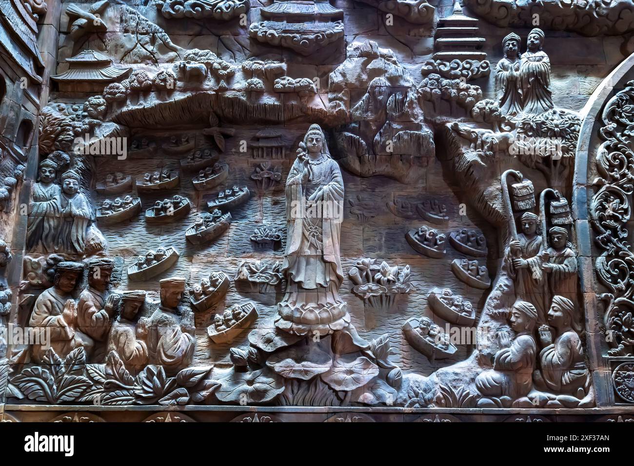 Stone carved base-relief of Ky Lan temple. Human figures and floral ...