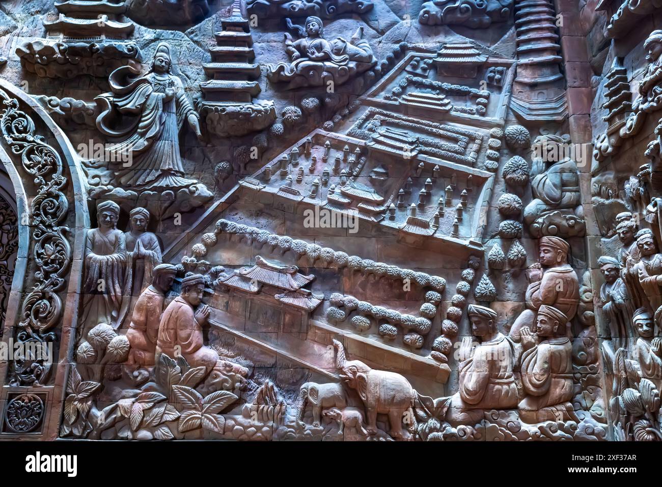Stone carved base-relief of Ky Lan temple. Human figures and floral ...