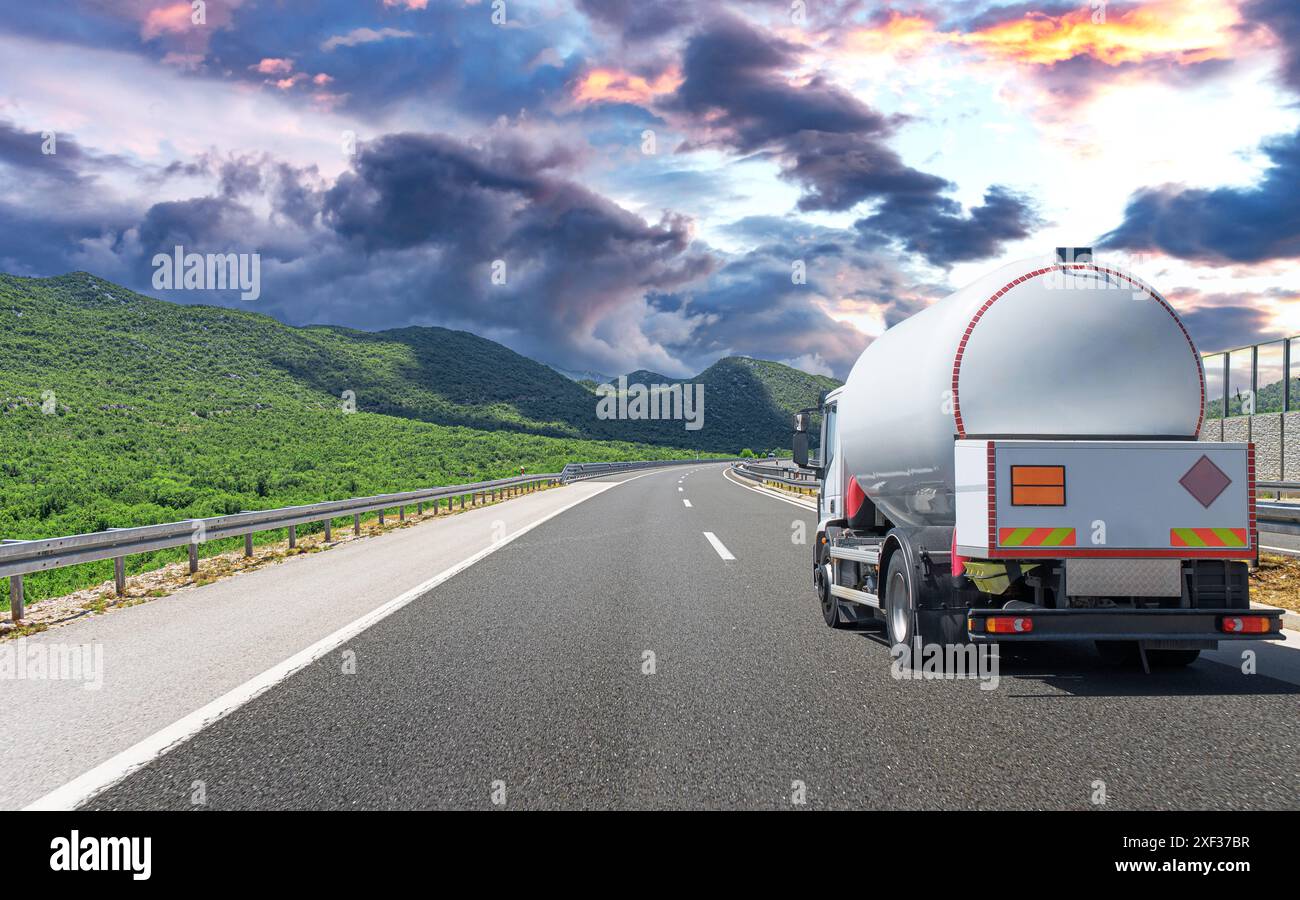 Fuel truck on a picturesque road Stock Photo - Alamy