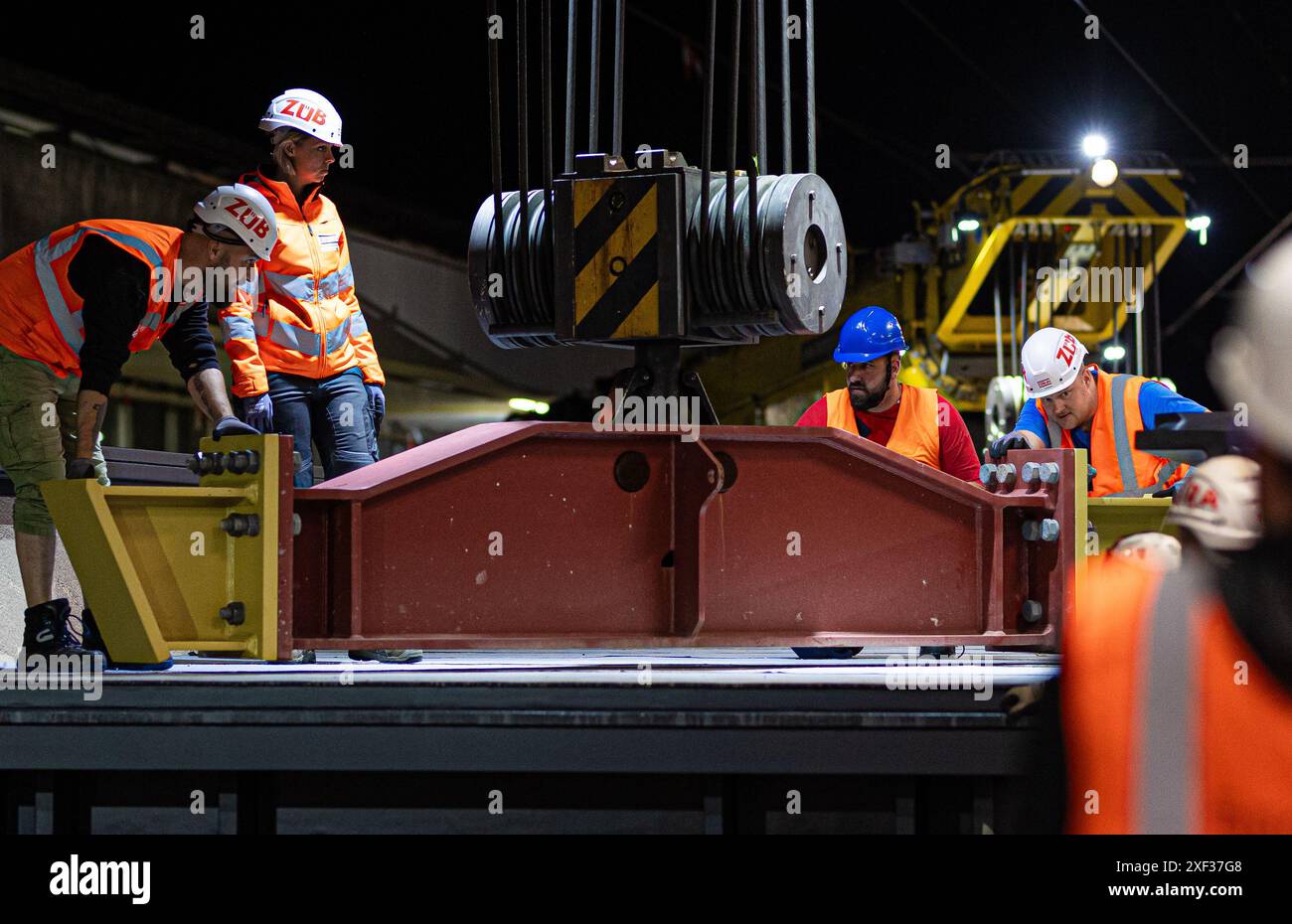Hanover, Germany. 30th June, 2024. Workers prepare a steel trough so ...