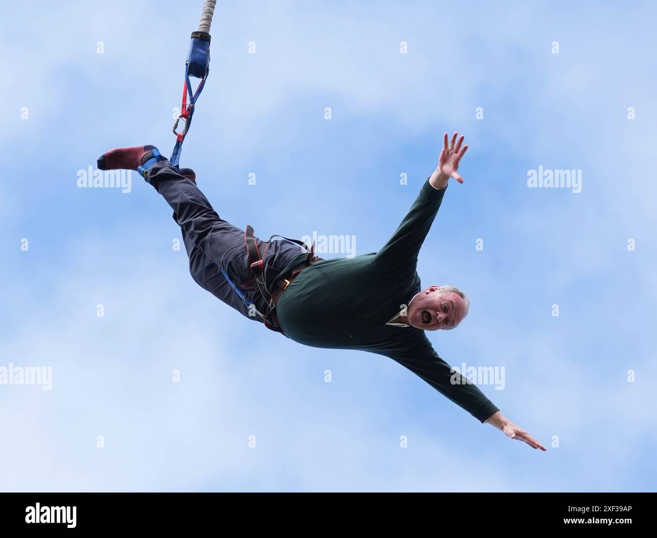 Liberal Democrat leader Sir Ed Davey taking part in a bungee jump ...