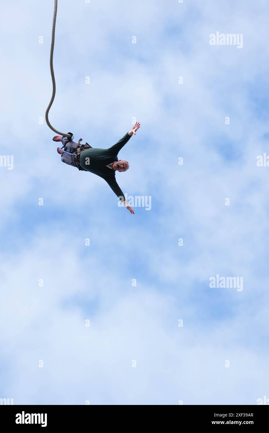 Liberal Democrat leader Sir Ed Davey taking part in a bungee jump ...