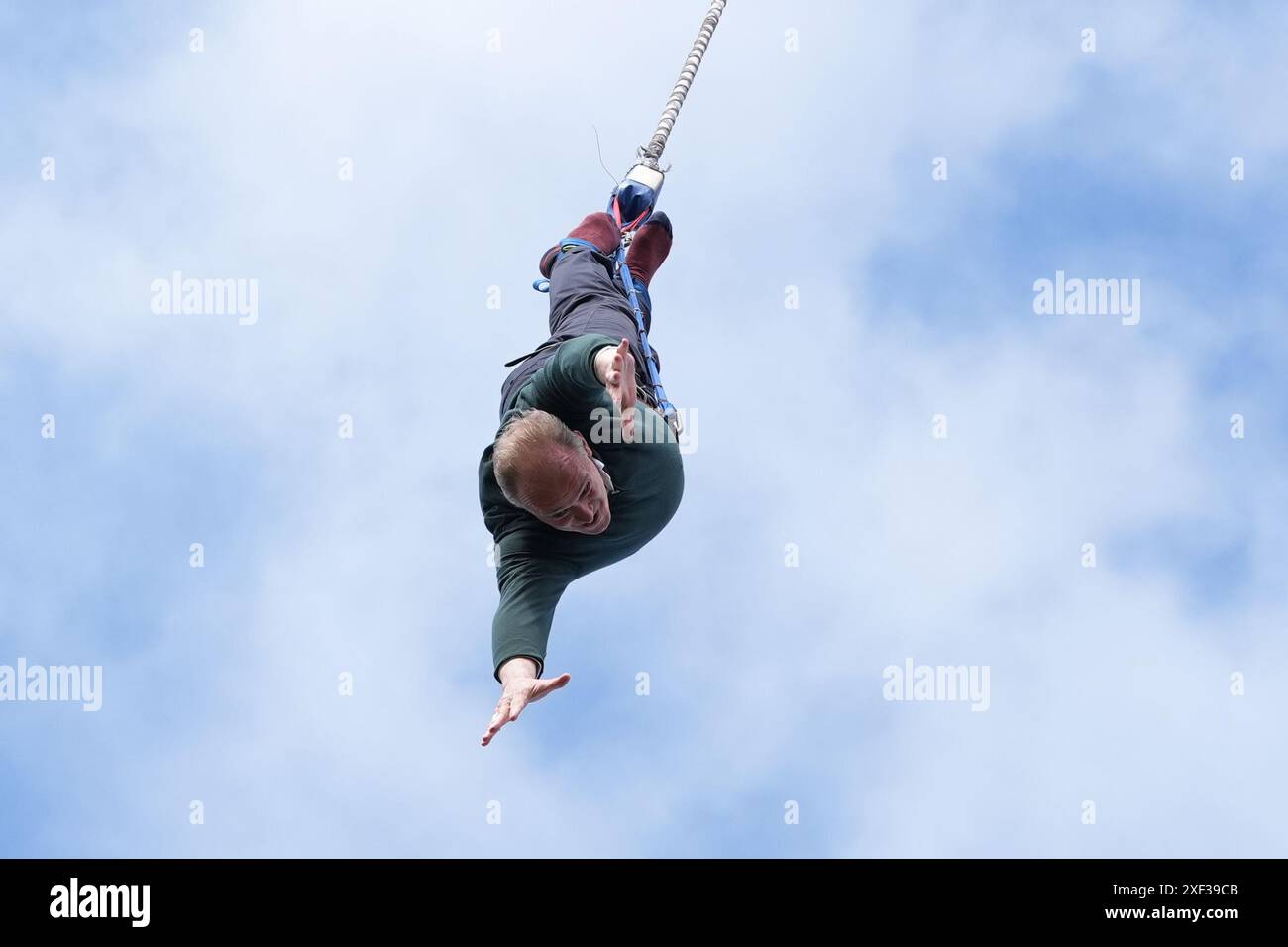 Liberal Democrat leader Sir Ed Davey taking part in a bungee jump ...