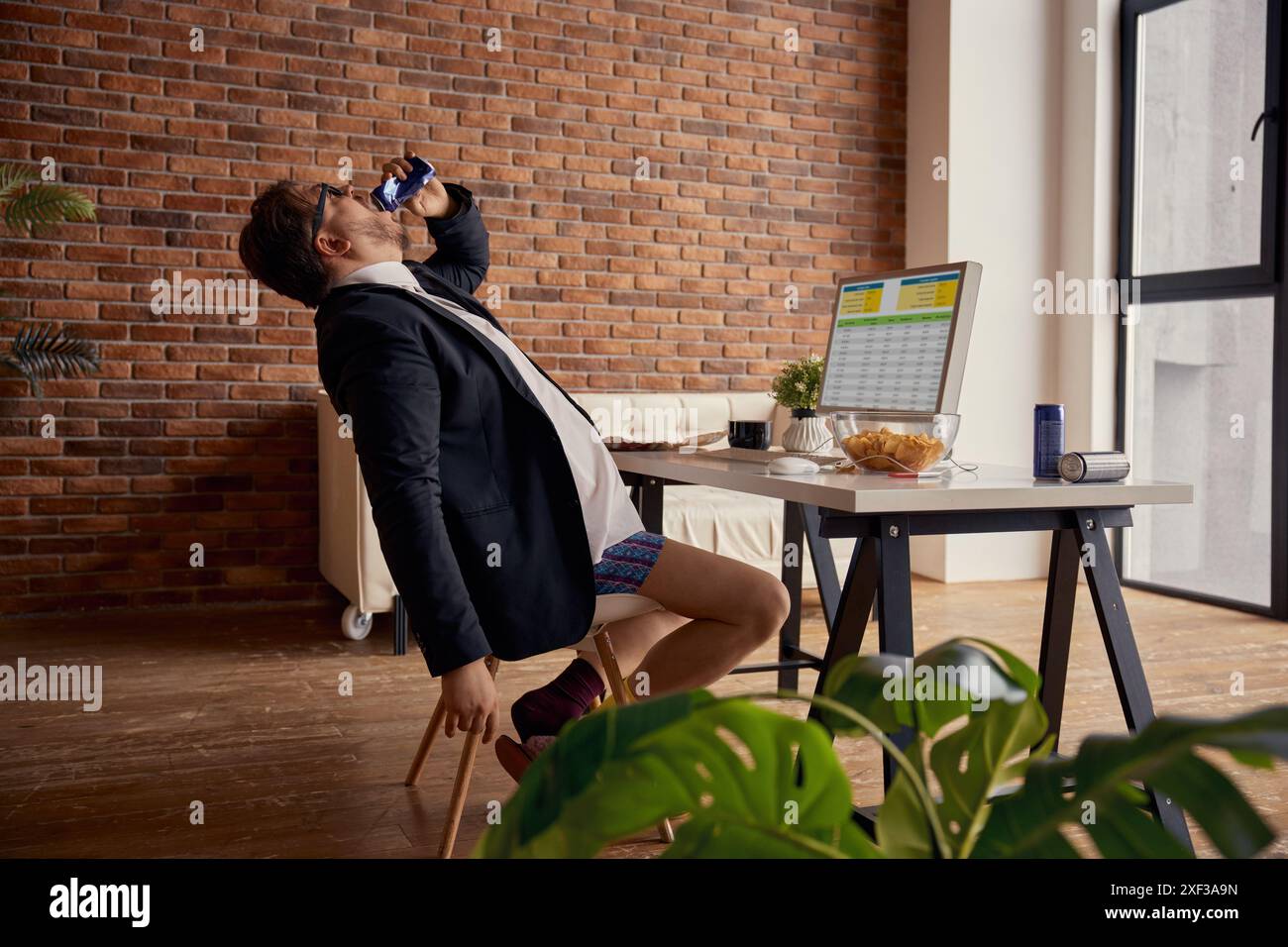 Funny businessman freelancer taking break from online work eating ...