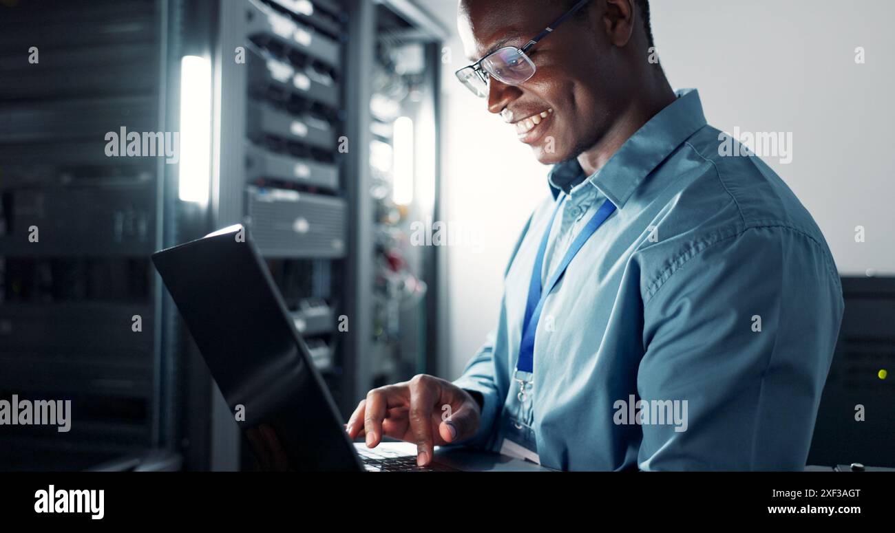 Laptop, server room and black man on database network for maintenance, programming software or ...