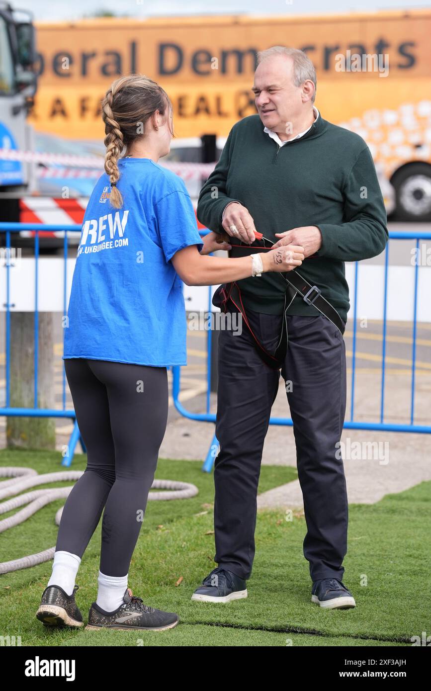 Liberal Democrat leader Sir Ed Davey getting prepared for a bungee jump ...