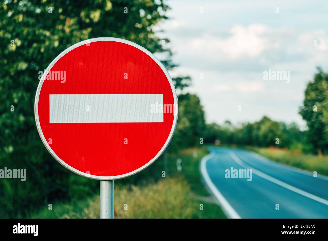 No Entry traffic sign by the empty european road, selective focus Stock ...