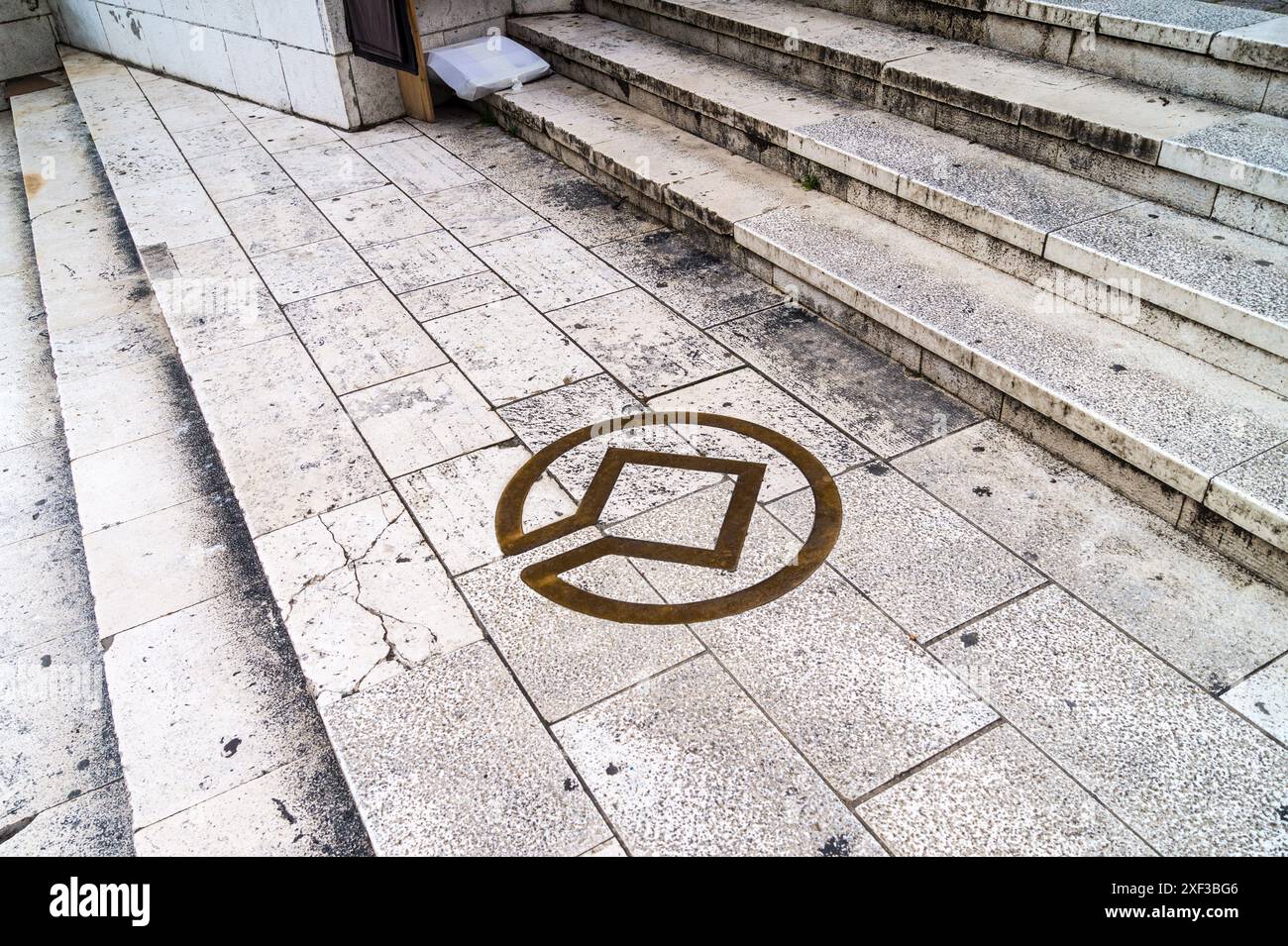 UNESCO symbol in brass inlaid into a marble floor, Diocletian's palace ...