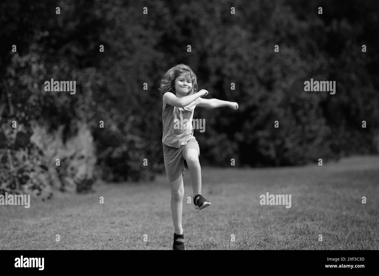 Happy children running in countryside Black and White Stock Photos ...