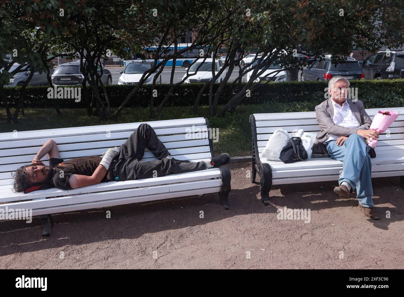 St. Petersburg, Russia. 30th June, 2024. A homeless man with a cast on ...
