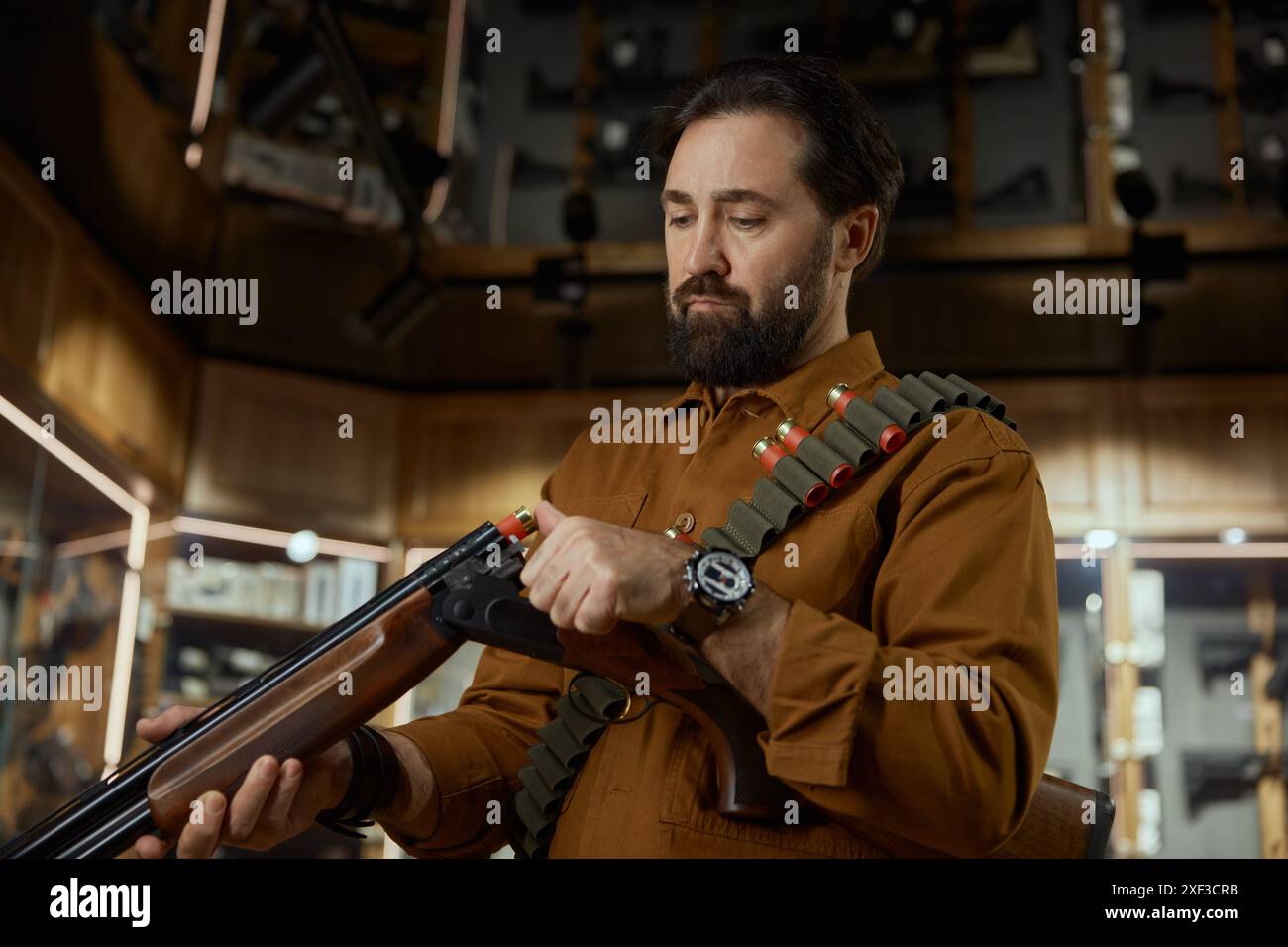 Man loading bullet into the rifle at legal commercial weapon store for ...