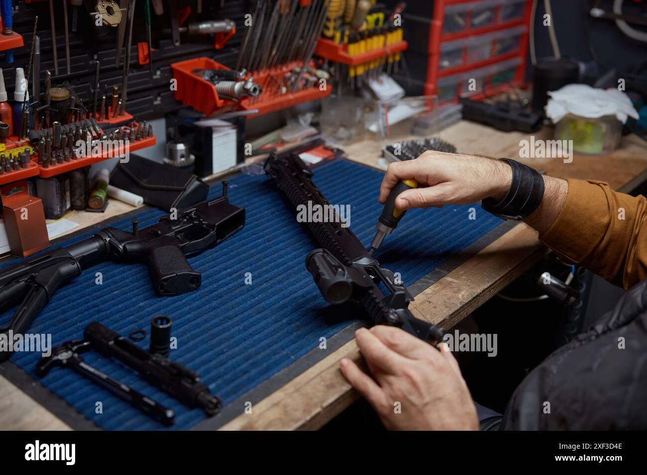 Man putting gun with ammunition in safety case top view closeup Stock ...