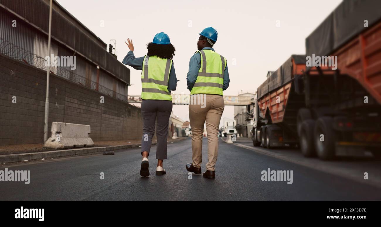 Construction worker, team or talking with planning at site in morning ...