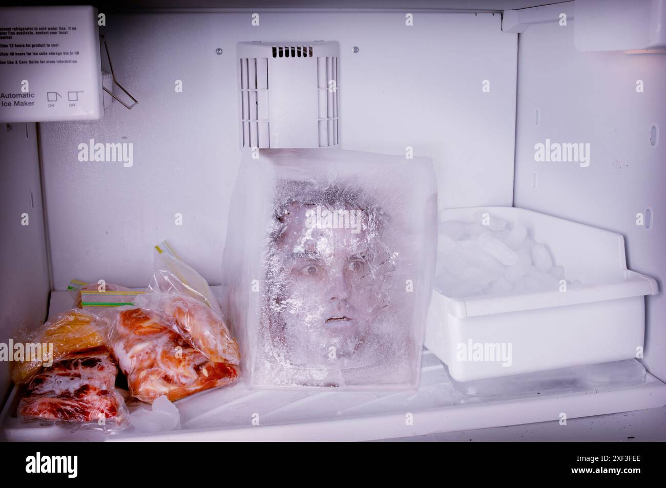 Frozen human head inside block of ice in freezer Stock Photo - Alamy