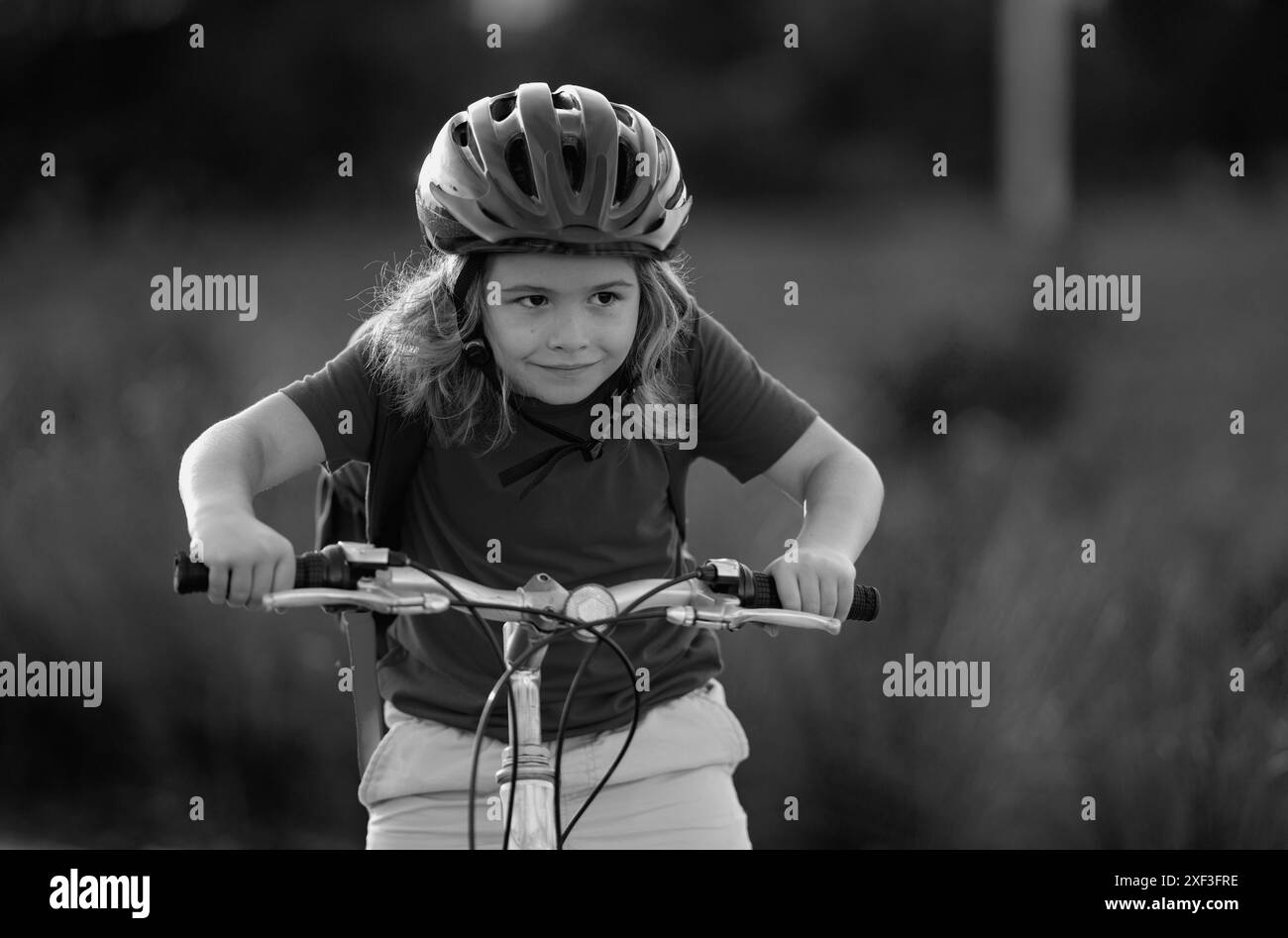 Little kid boy ride a bicycle in the park. Kid cycling on bicycle ...