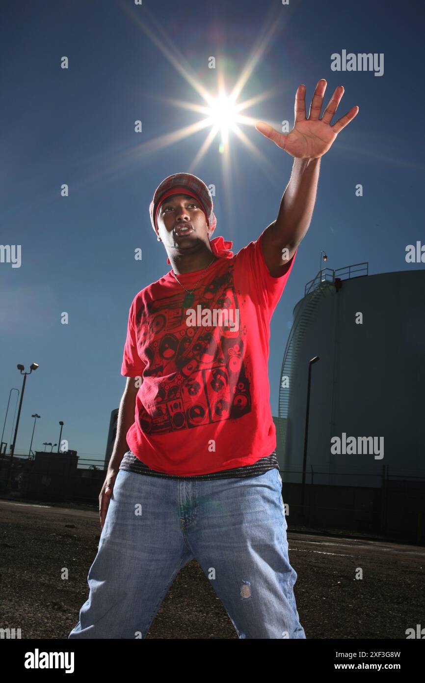 An African-American rapper and dancer poses for a portrait in an urban ...