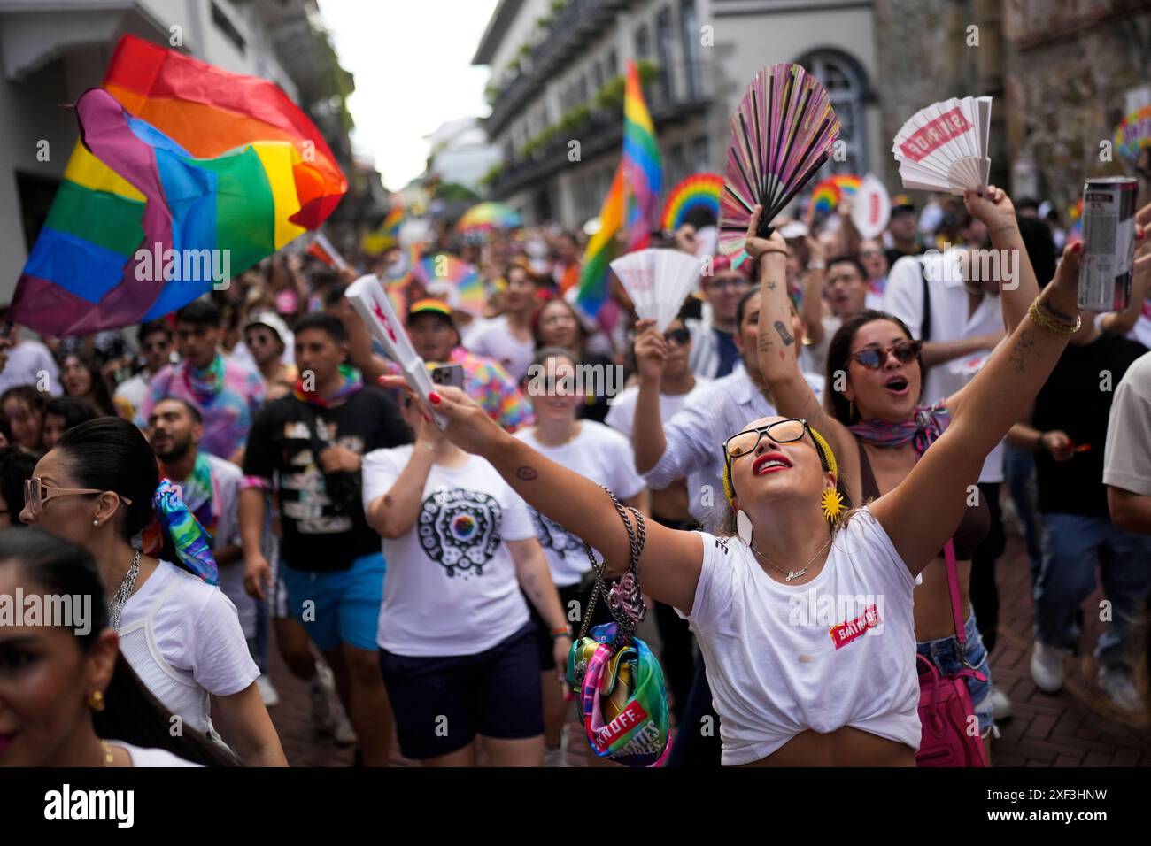 Revelers take part in a Pride parade marking the culmination of LGBTQ+ ...