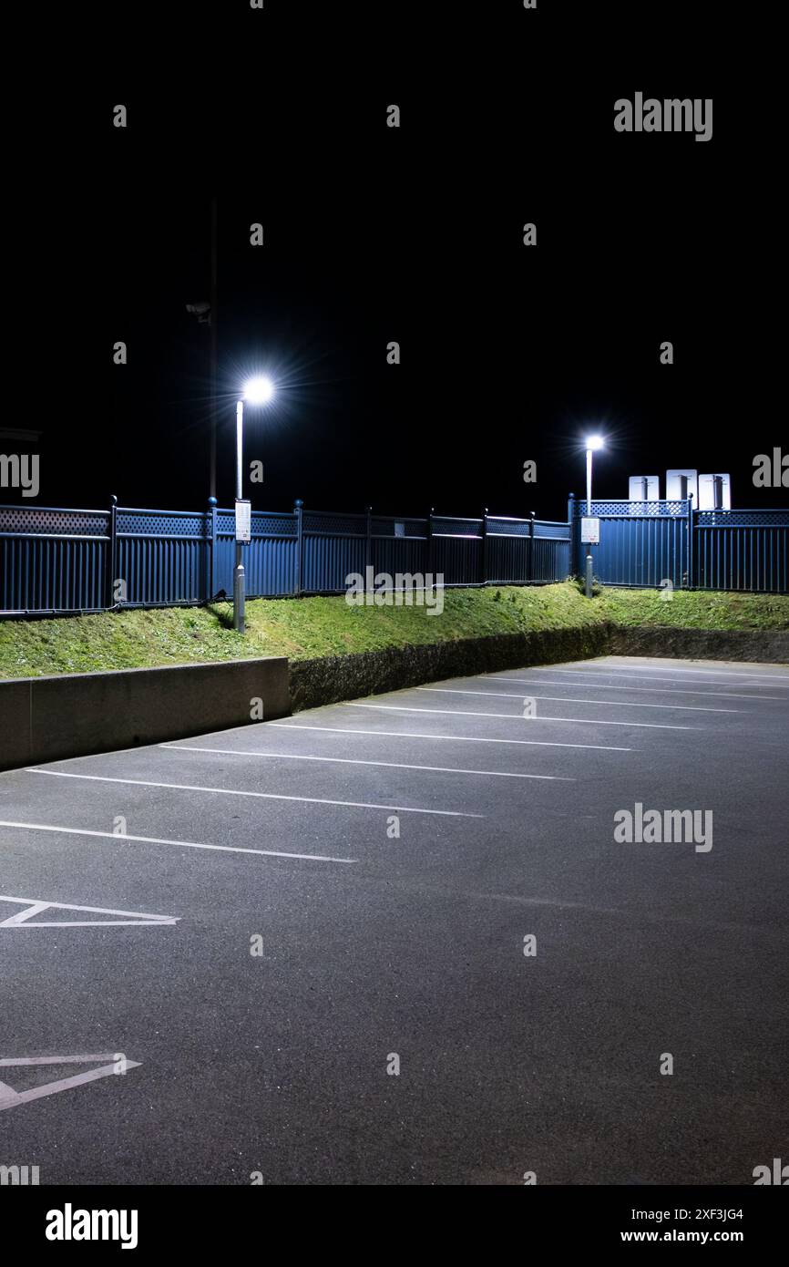 An empty deserted car park at night in Newquay in Cornwall in the UK ...