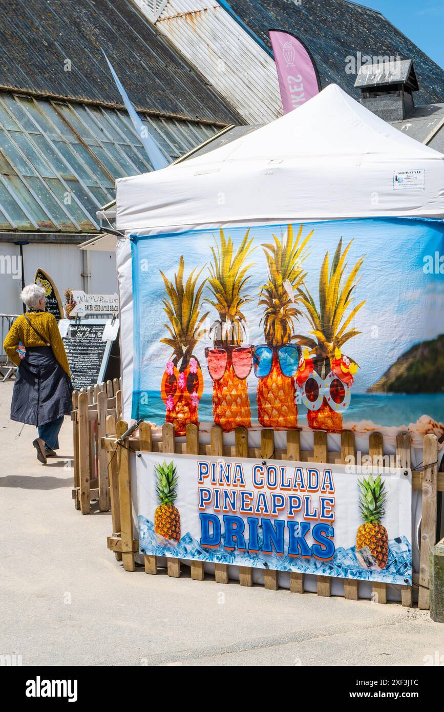 A colourful colorful banner advertising pina colada pineapple drinks on ...
