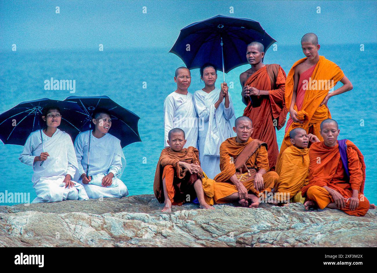 Thailand - Buddhist monks and nuns at the beach of Koh Samet island ...