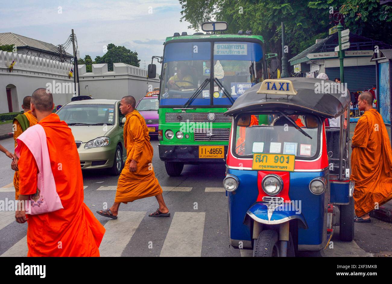 Thailand, Bangkok. Buddhist monks crossing a busy street Stock Photo ...