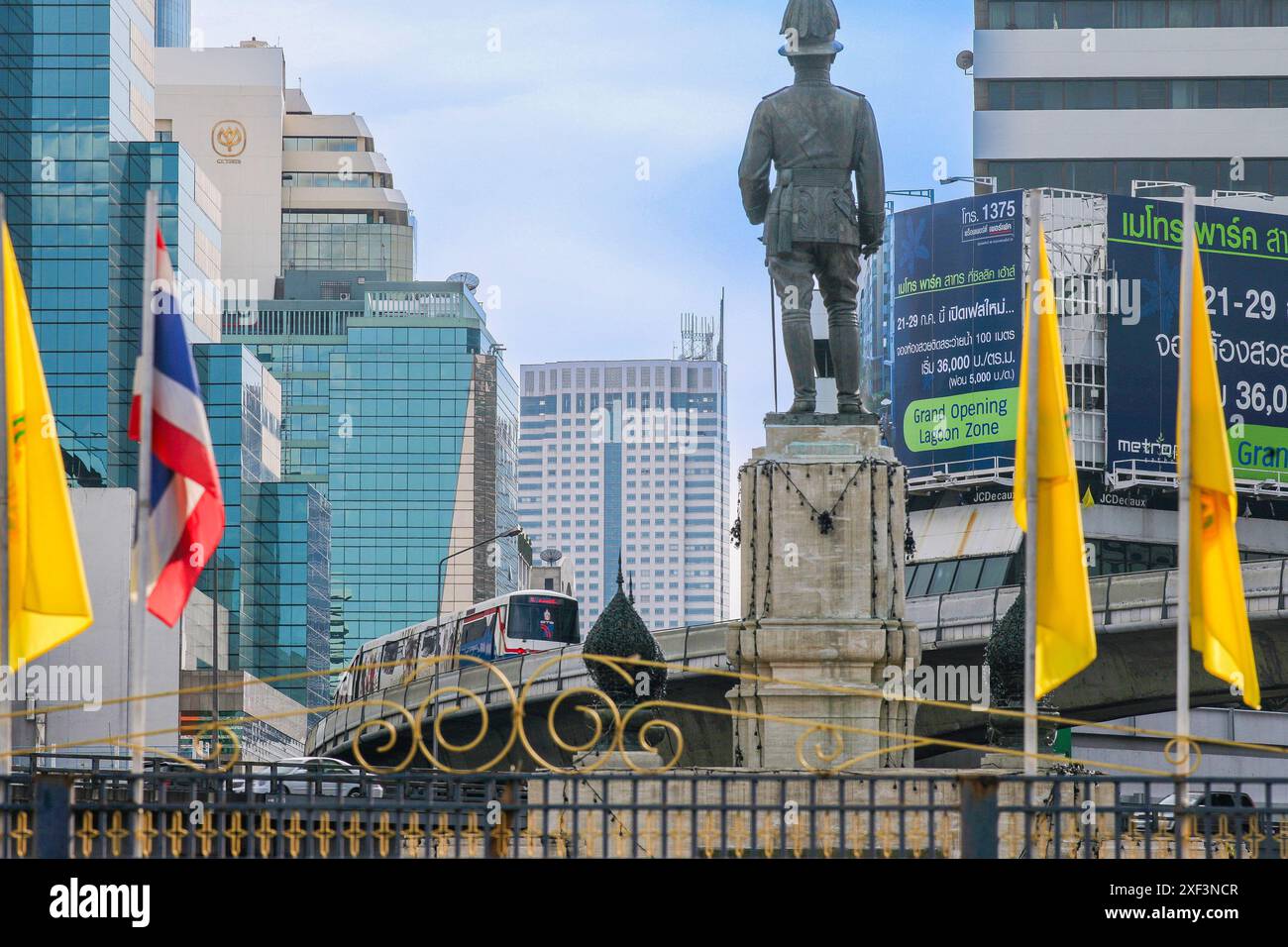 Thailand, Bangkok; Skytrain and statue of King Rama VI at the entrance ...