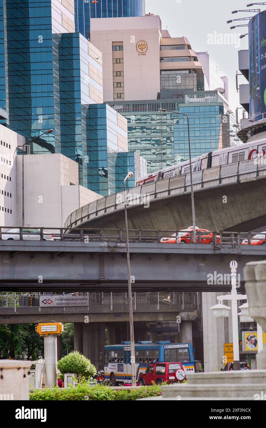 Thailand, Bangkok; Fly over with skytrain, cars and bus at Silom Road ...