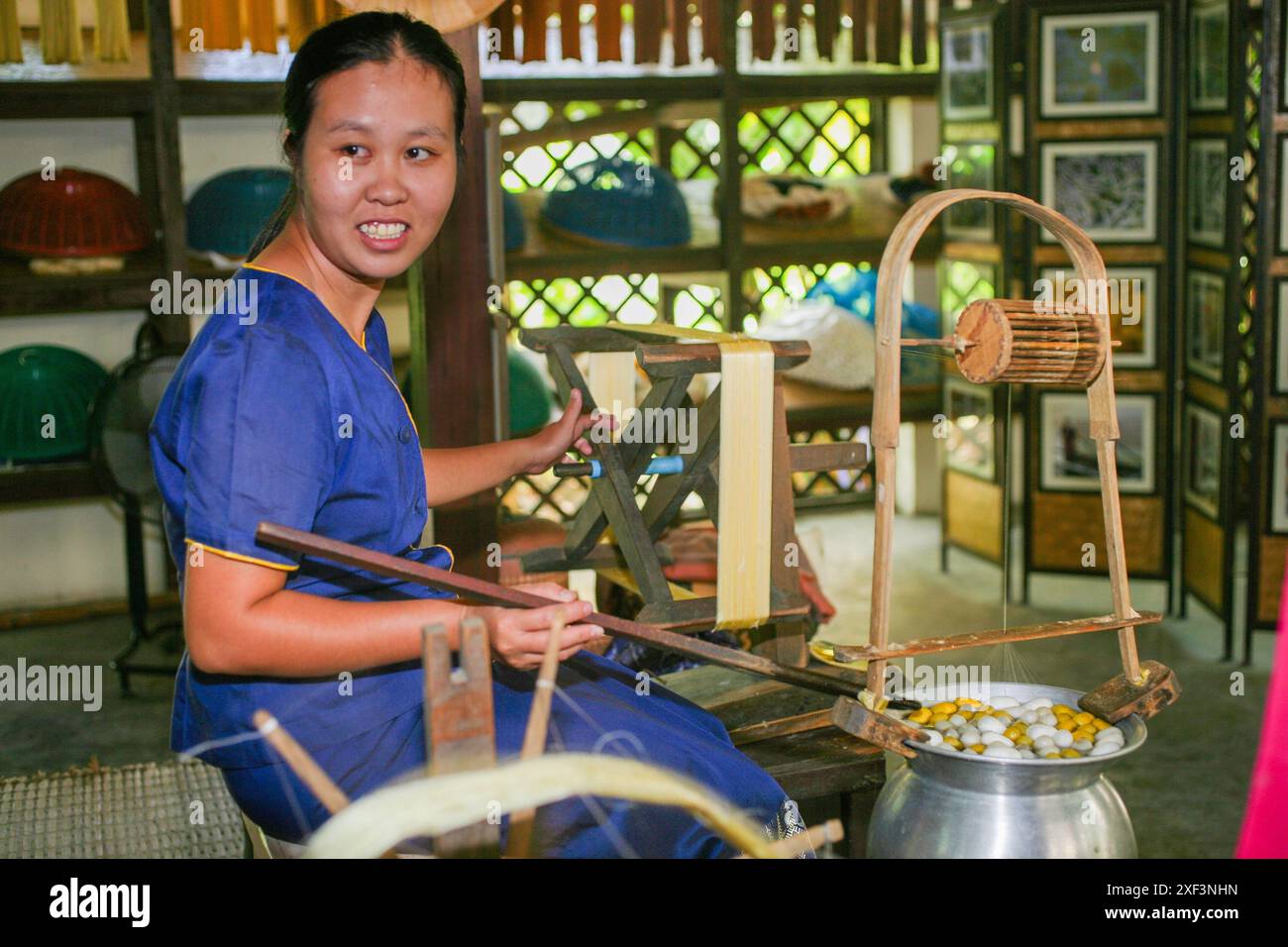 Thailand, Chiang Mai; Women in a small scale silk production factory ...