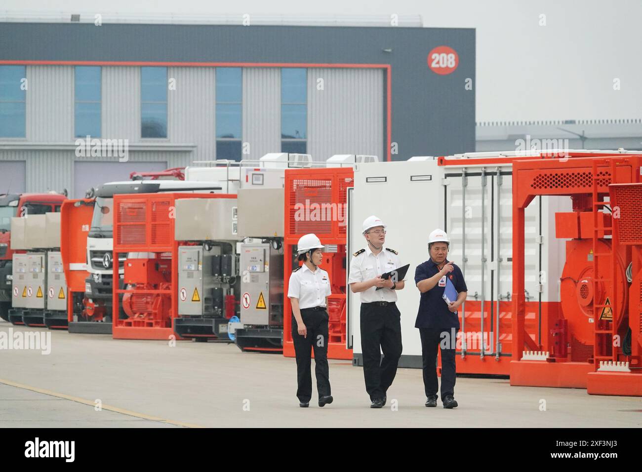 YANTAI, CHINA - JULY 1, 2024 - Customs officers give instructions to ...