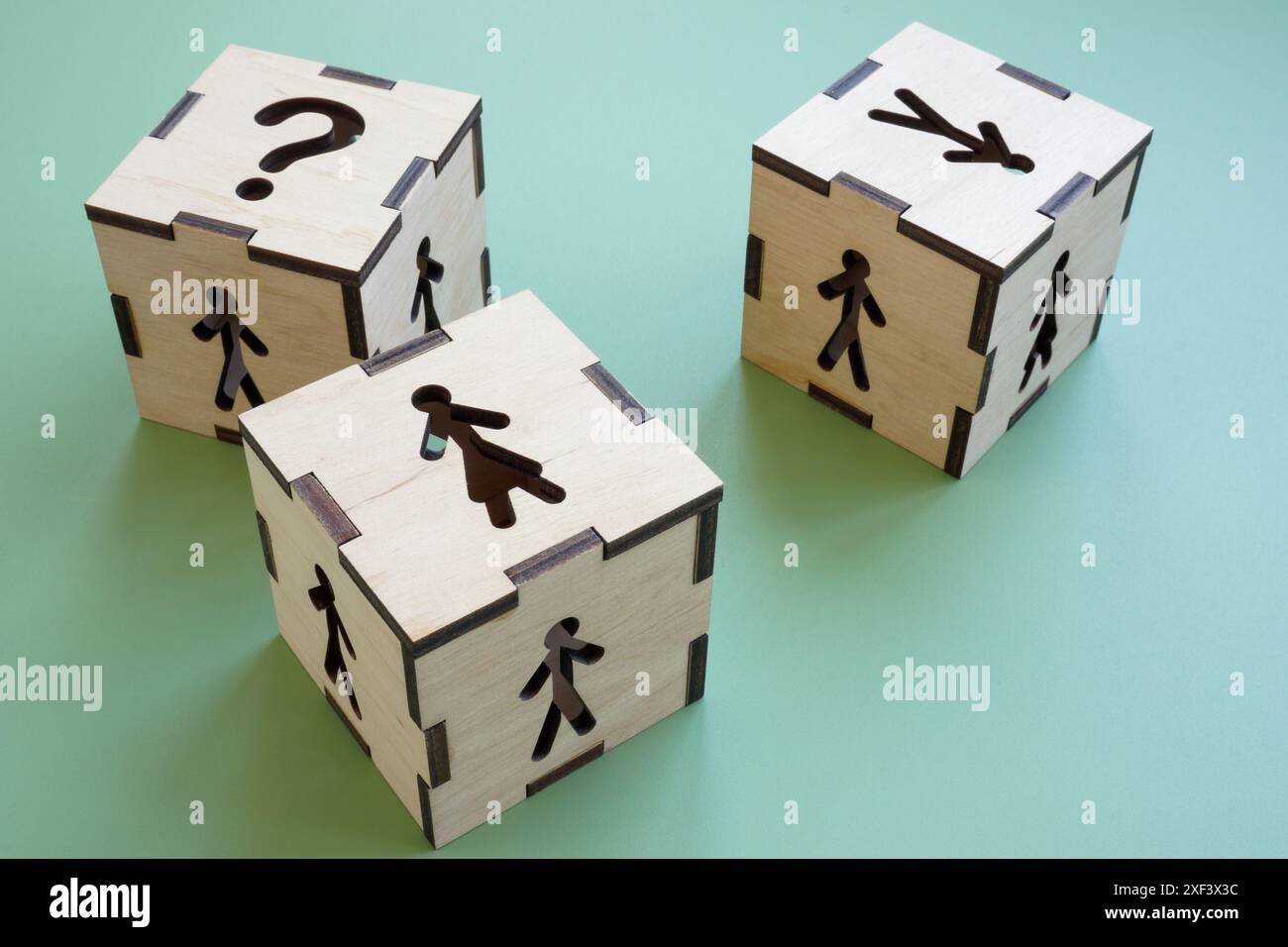 Cubes with figures of a woman, a man and question mark. Gender equality ...
