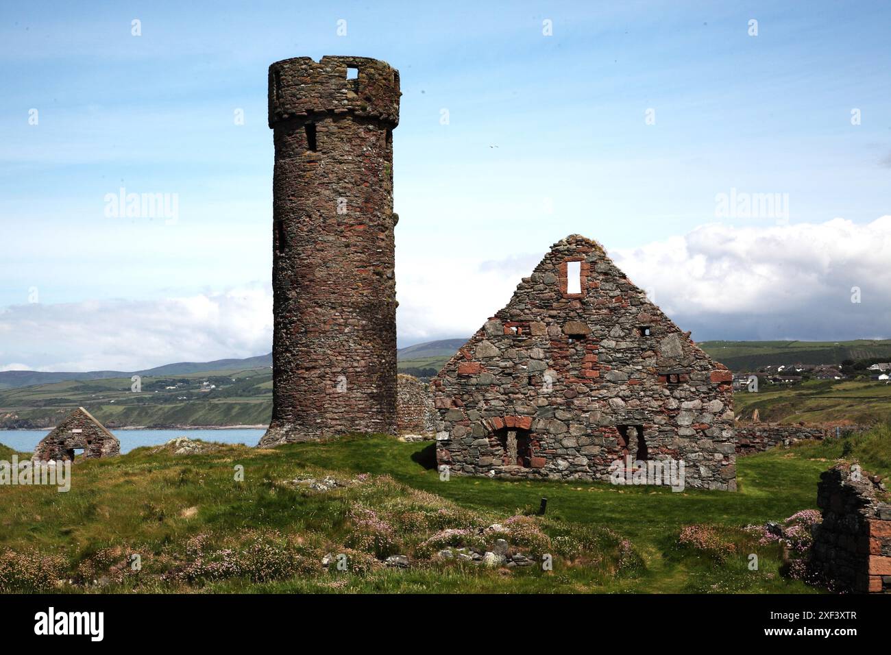 The 11th.Century Round tower and ruins of St.Patrick's Church in Peel Castle at Peel in the Isle ...